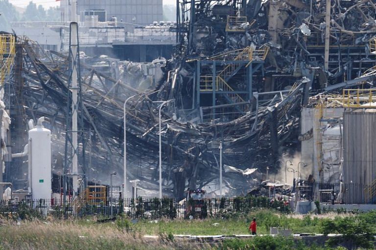 Residents pick up the pieces one day after deadly China chemical blast ... Residents pick up the pieces one day after deadly China chemical blast ...